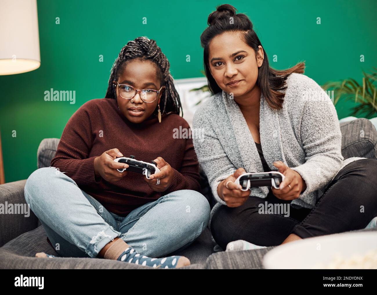 Gaming isnt just for the guys. two young women playing video games on ...