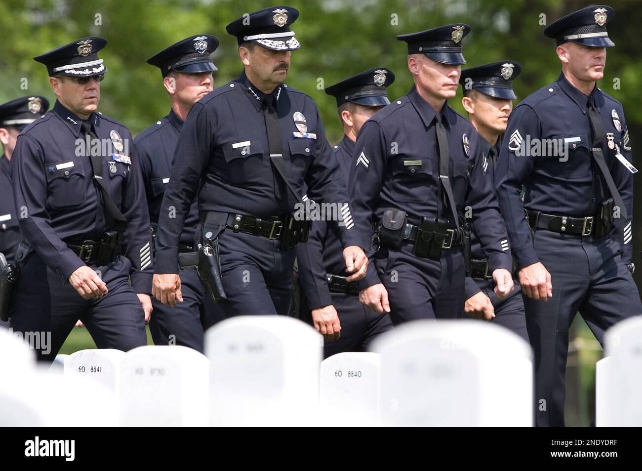 Los Angeles Police Department Chief Charlie Beck, center, leads members ...