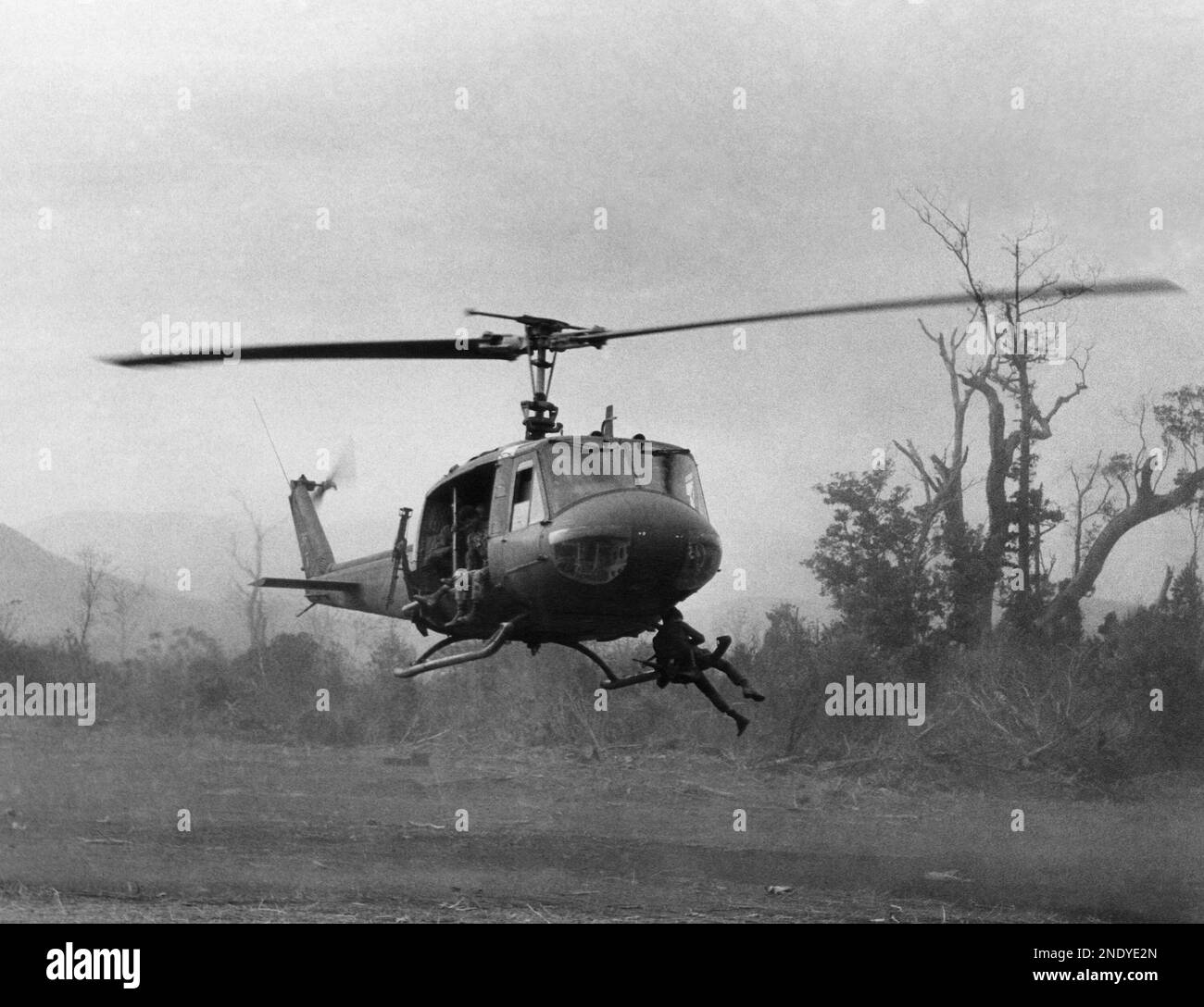 A South Vietnamese solider rides on the skid of a Medivac helicopter as ...