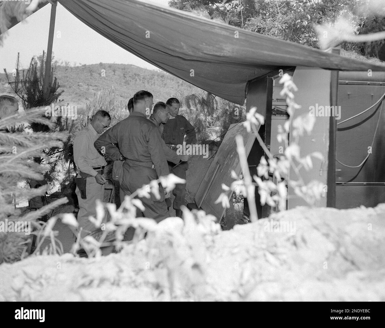 Gen. Matthew Ridgway looks intent as he studies a map of the fighting ...