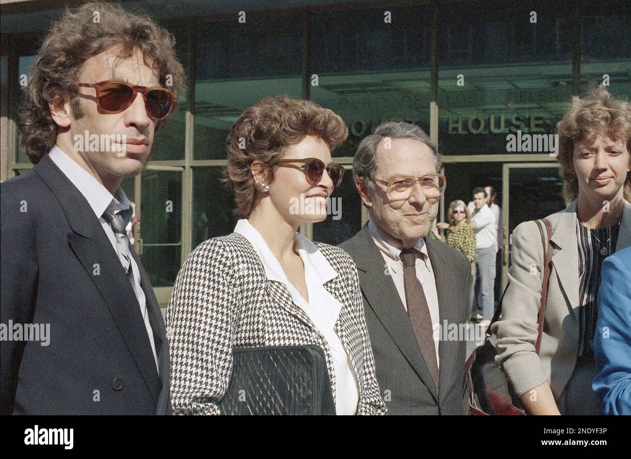 Raquel Welch is shown with husband Andre Weinfeld, left, and attorney ...