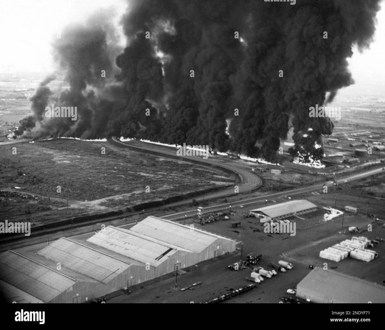 Smoke rises from five fuel tanks at Long Bihn, South Vietnam set afire ...