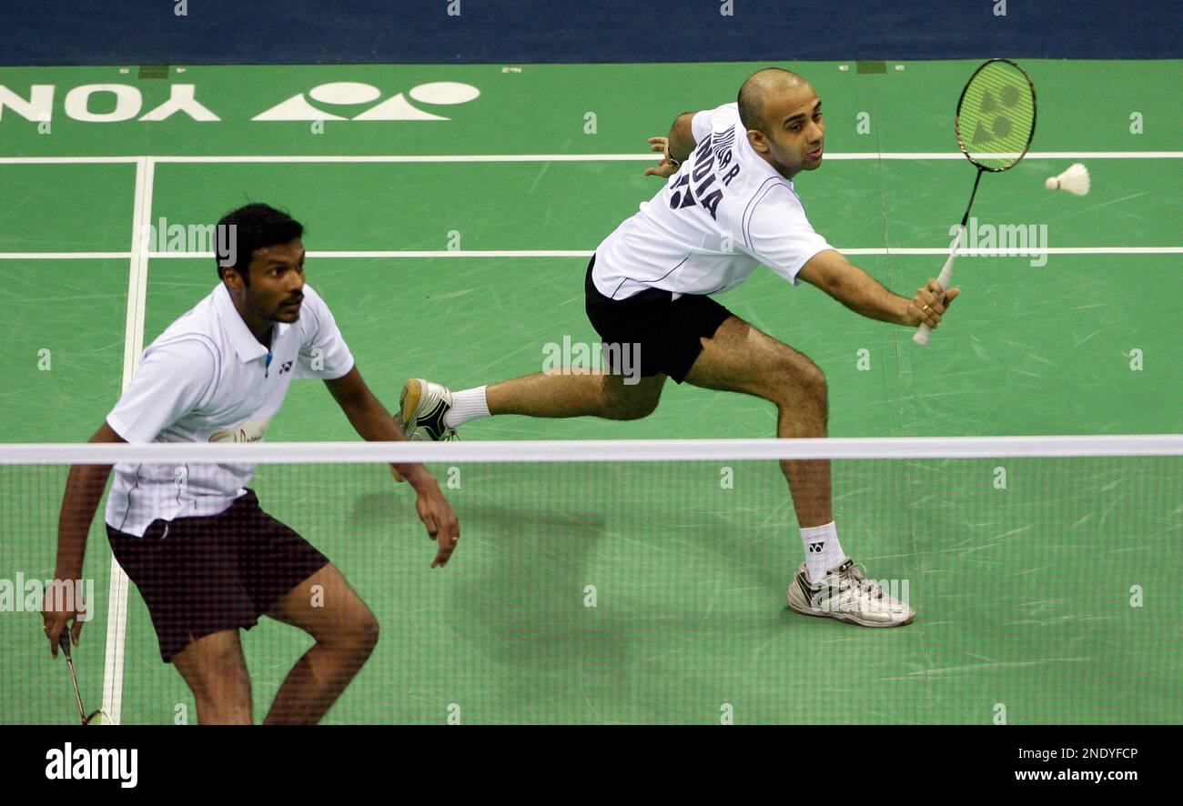 India's Rupesh K T Kumar, right, tries to return a shot as his doubles ...