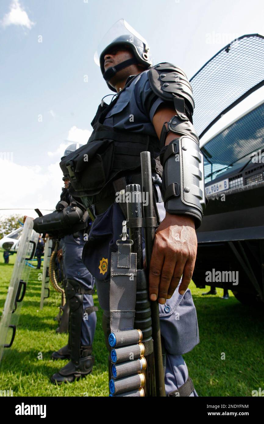 South African Police members displays their uniforms and other new gear ...