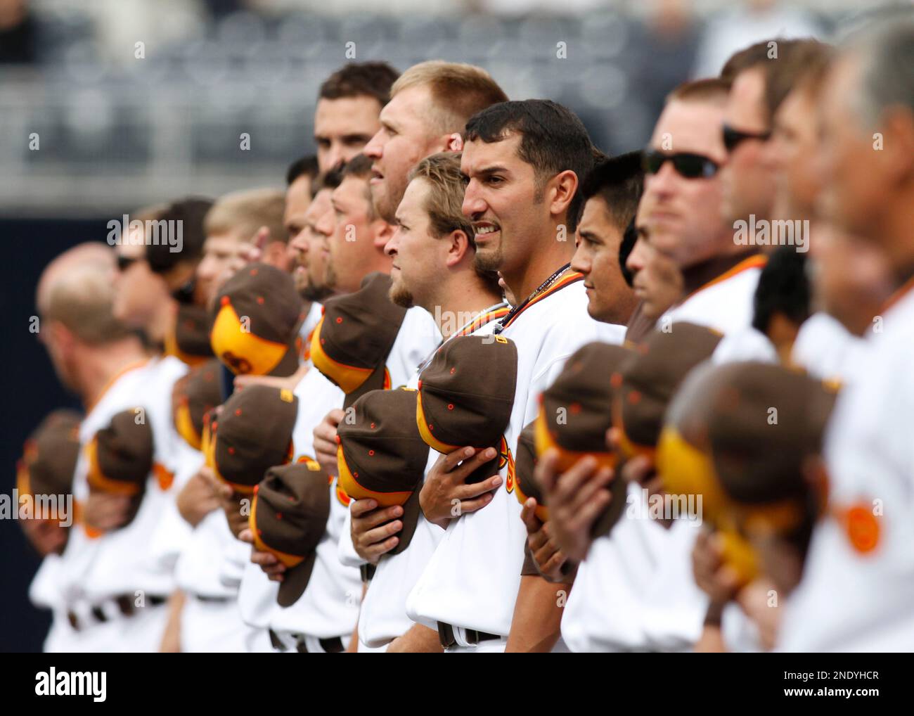 San Diego Padres players line up before the start of a baseball game ...