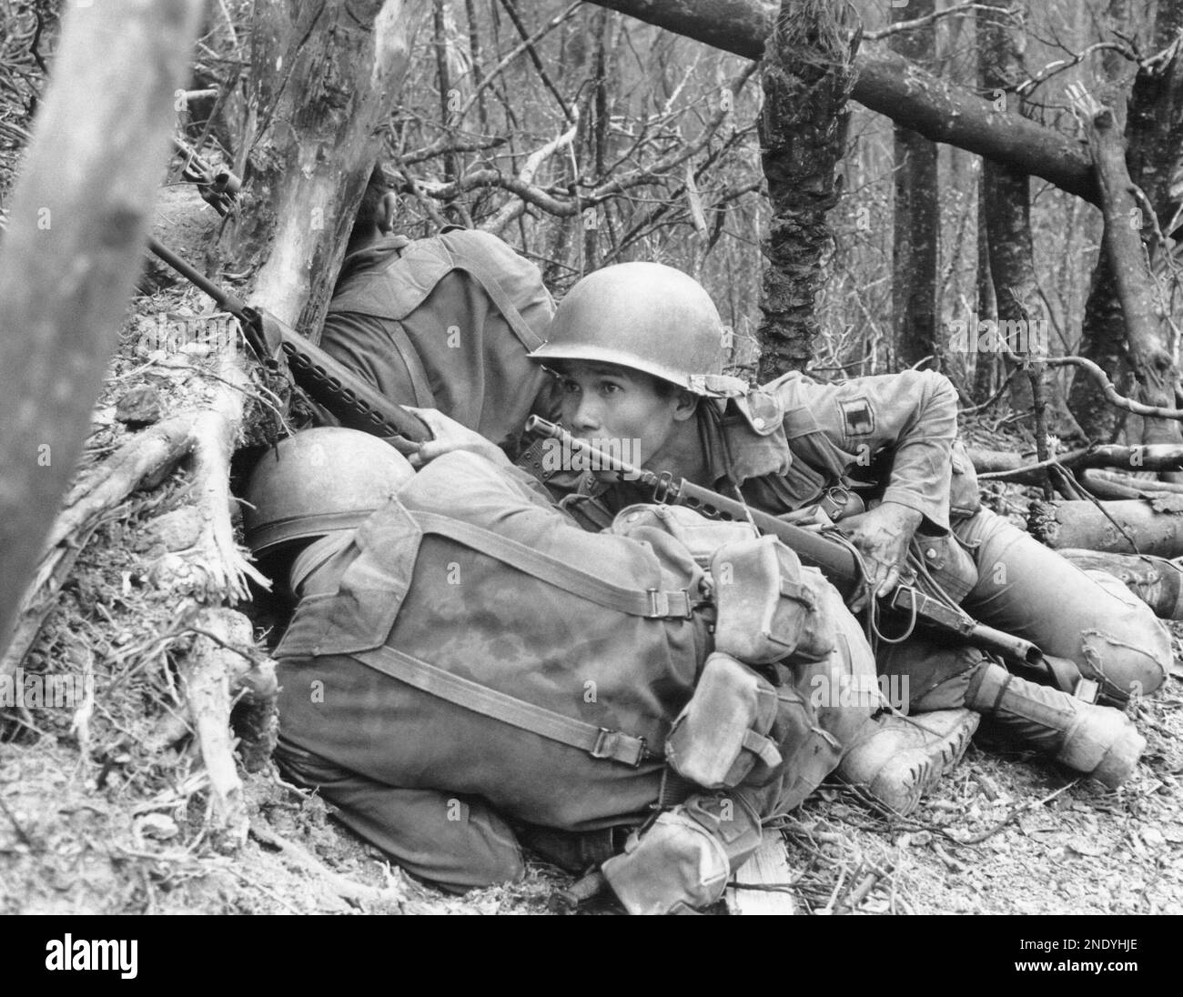 South Vietnamese troopers, under fire from North Vietnamese positions ...