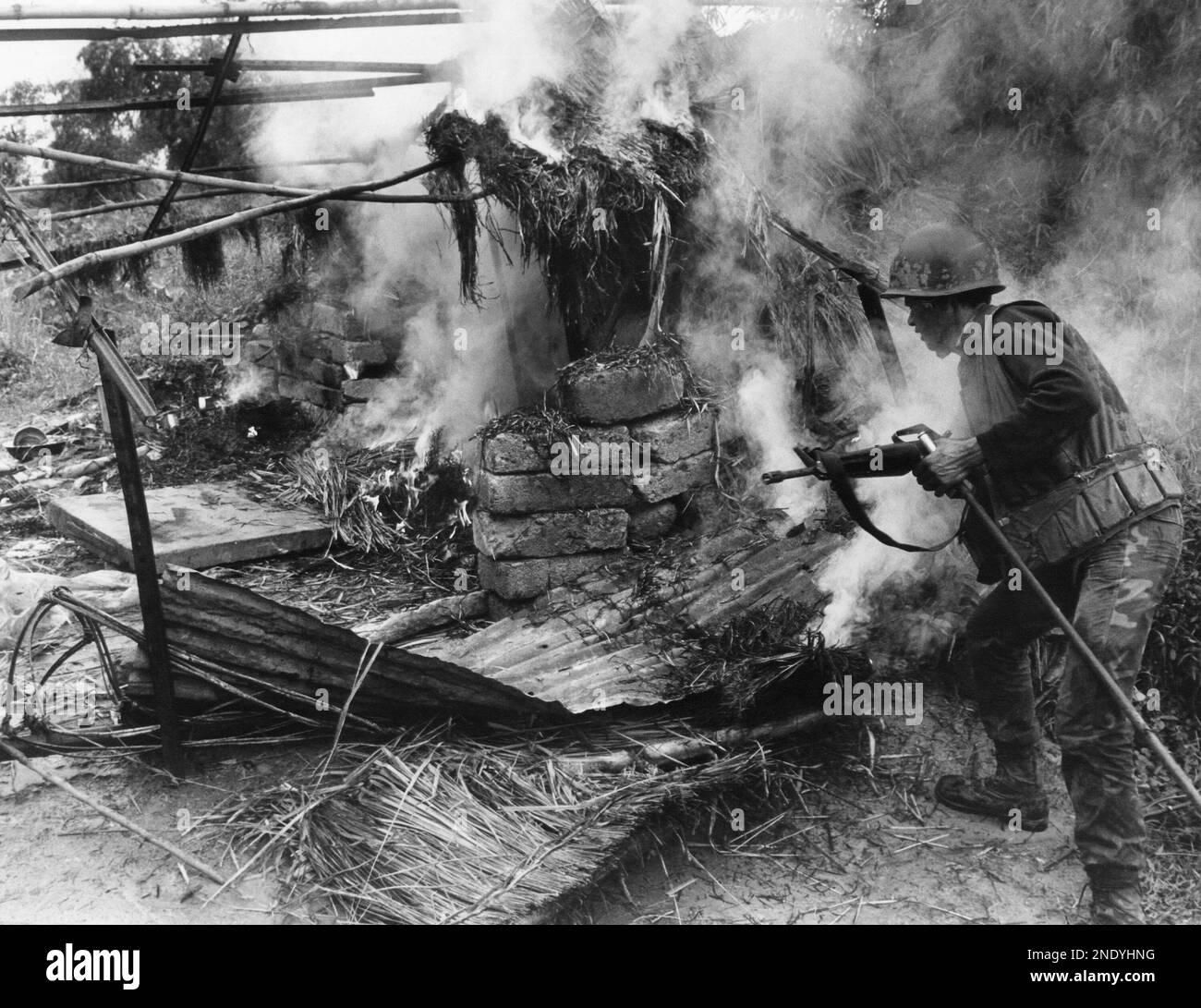 A South Vietnamese soldier screams at a Viet Cong hiding in bunker in ...