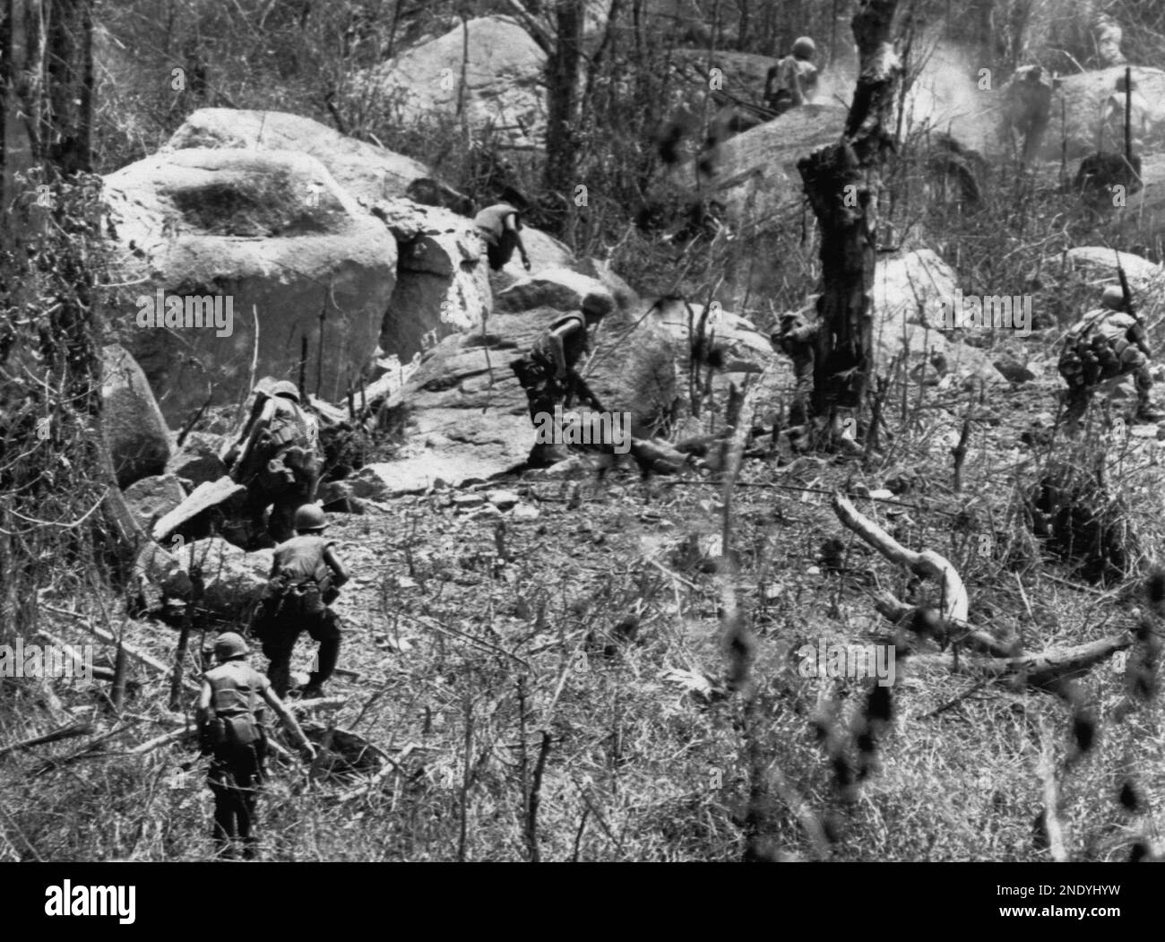 U.S. Marines are being fired upon as they charge entrenched troops of ...