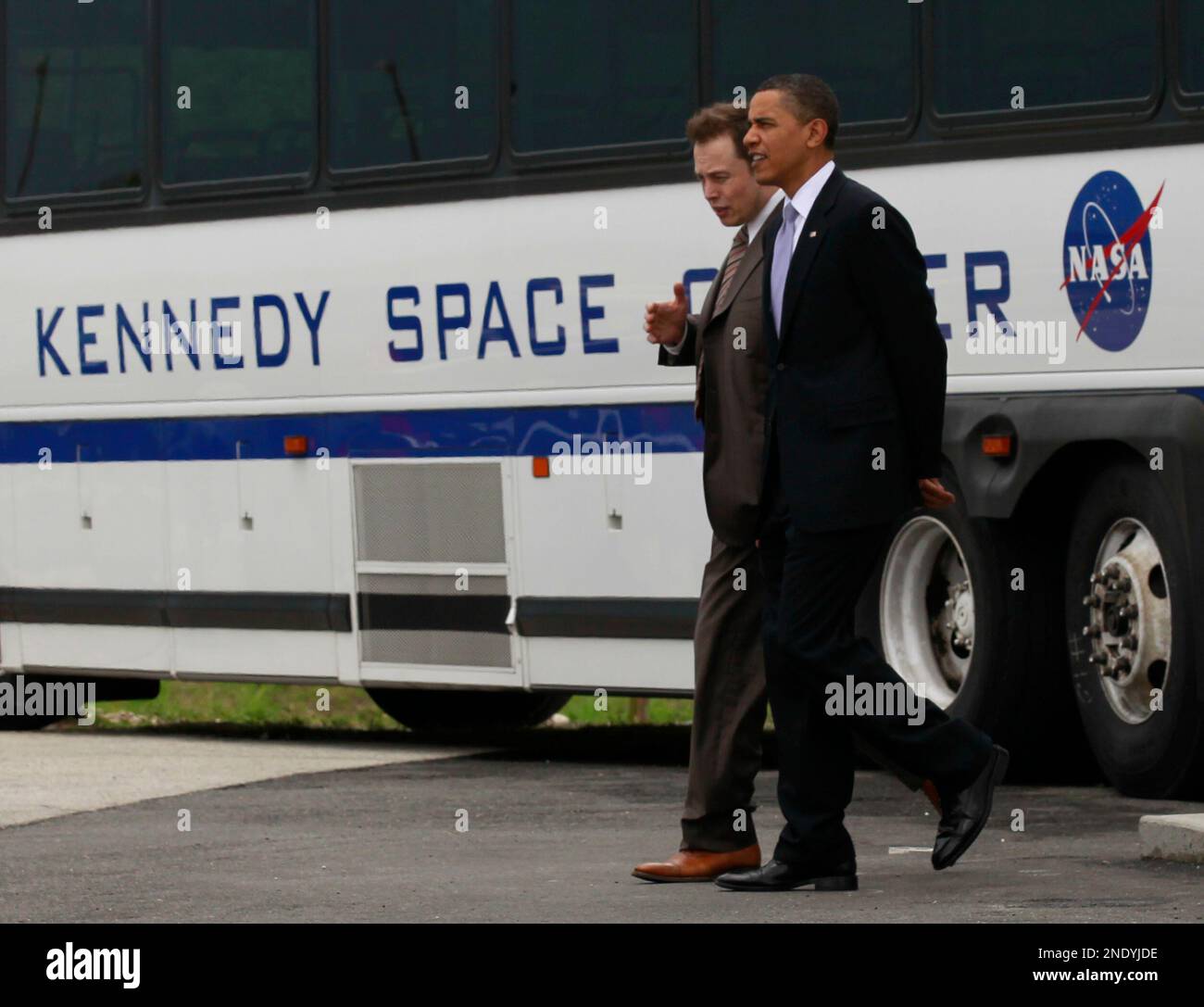 President Barack Obama walks to the SpaceX Falcon 9 launch vehicle with ...