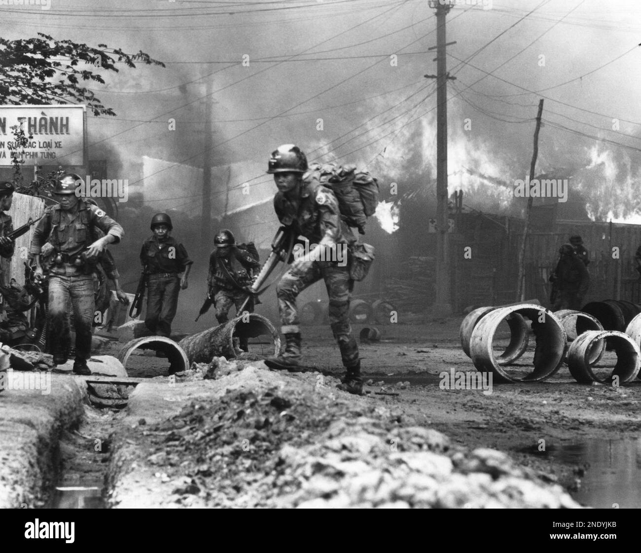 South Vietnamese rangers, ready to dive into available cover should the ...