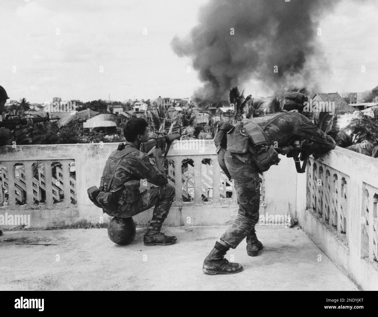 South Vietnamese rangers aim their rifles at Viet Cong positions in the ...