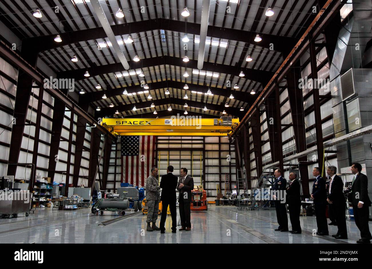 President Barack Obama, center, looks at the SpaceX Falcon 9 facility ...