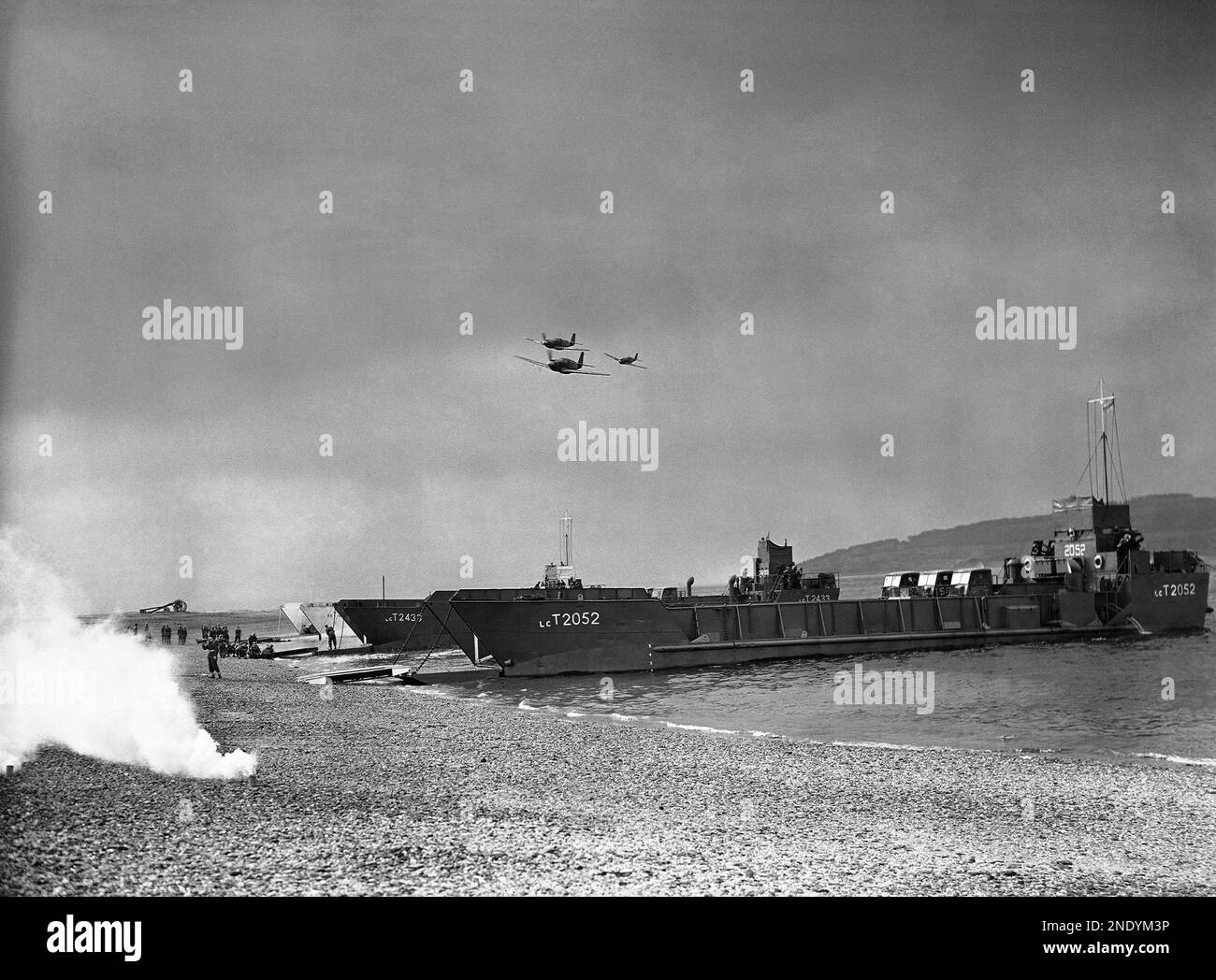 An attacking force rushes ashore from landing crafts during a pre ...