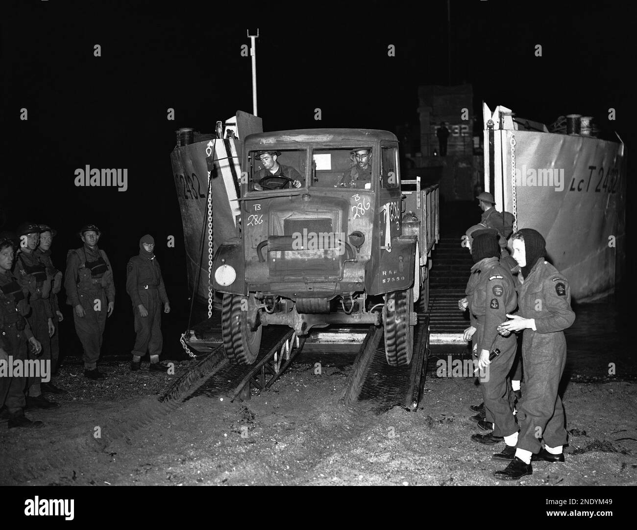 A lorry from the Royal Air Force Regiment driven ashore from a landing ...