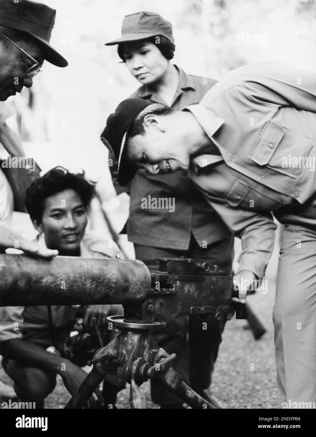 South Vietnam President Nguyen Van Thieu looks over an old U.S. water ...