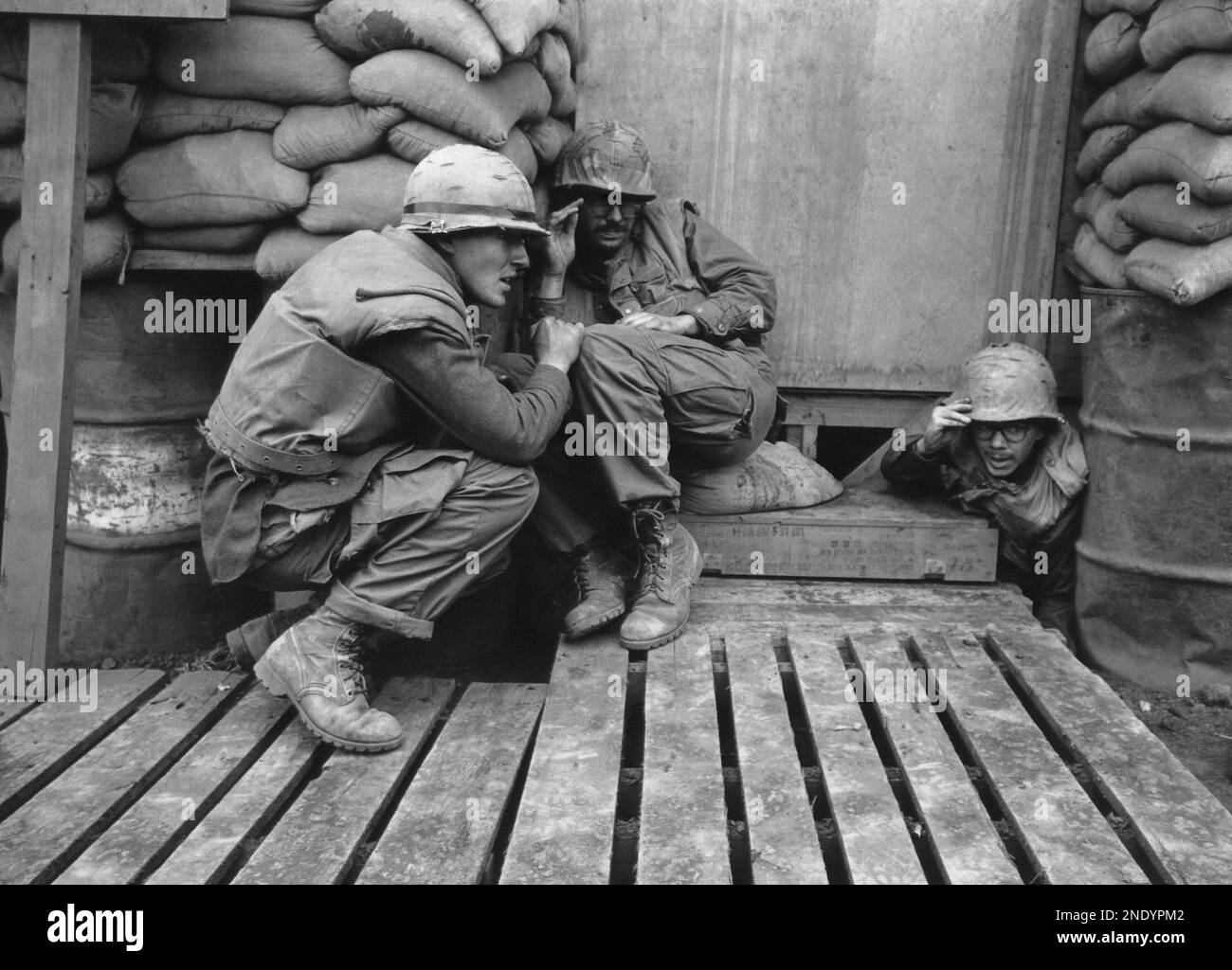 American soldiers take shelter in a sandbagged bunker as North ...
