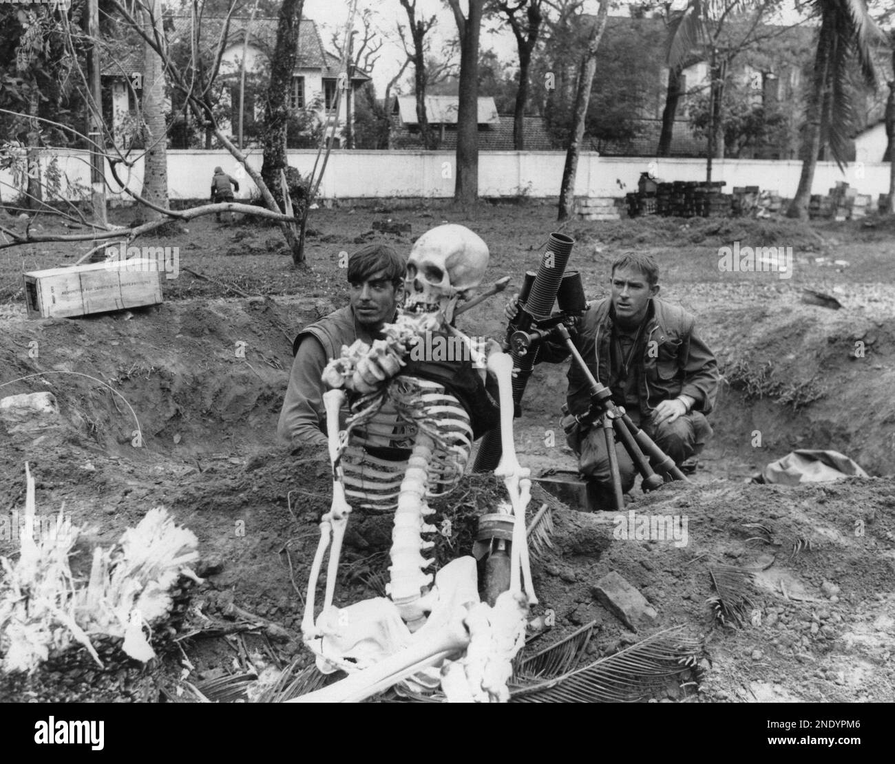 U.S. Marines have set up a skeleton next to their 81MM mortar position ...