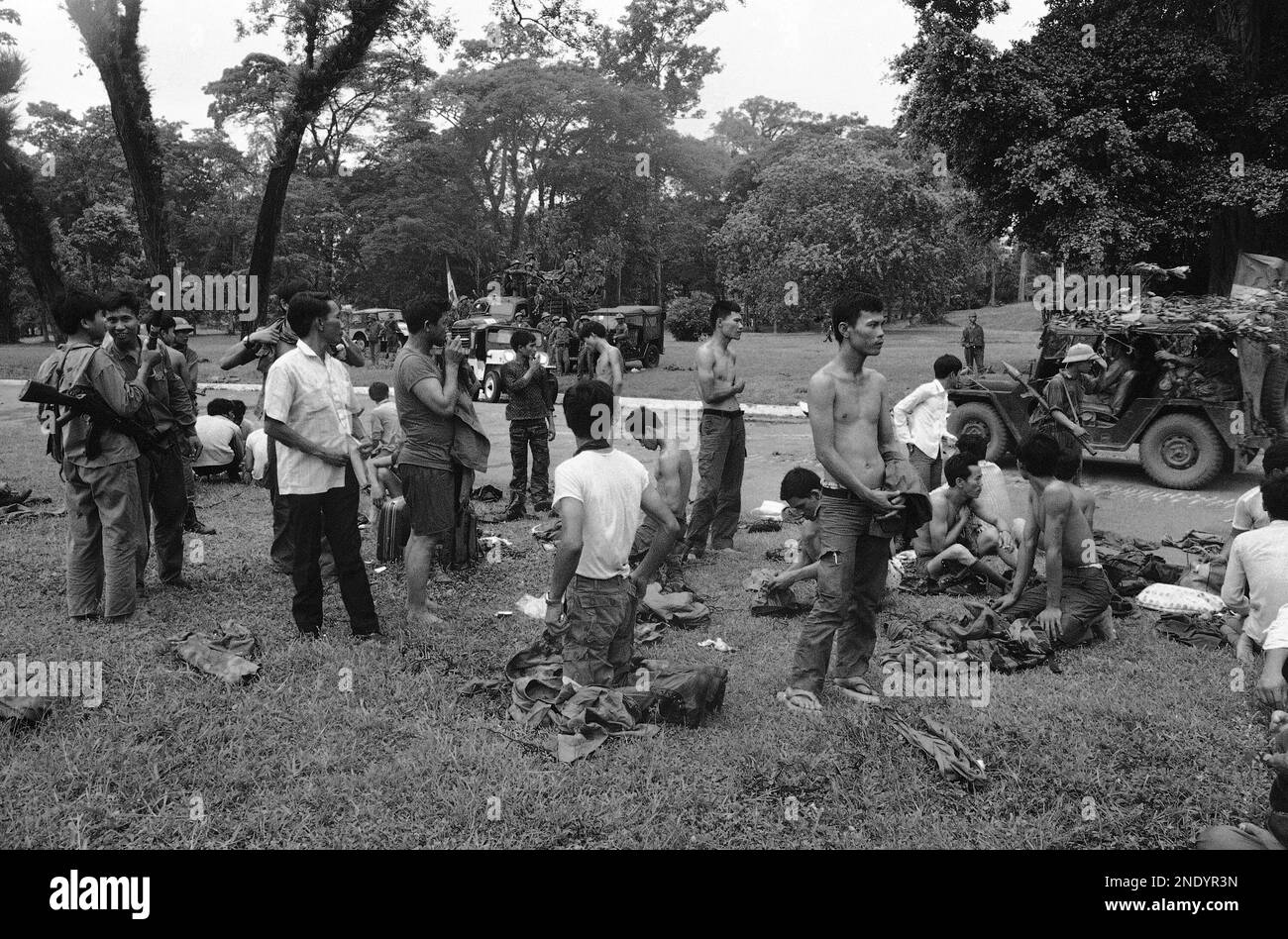 Disarmed ARVN throwing away uniforms infront of Independence Palace after President Duong van ...