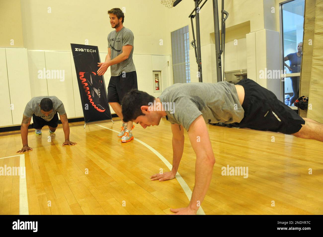 Actor Liam Hemsworth, center, trains attendees at the Reebok ZigTech ...