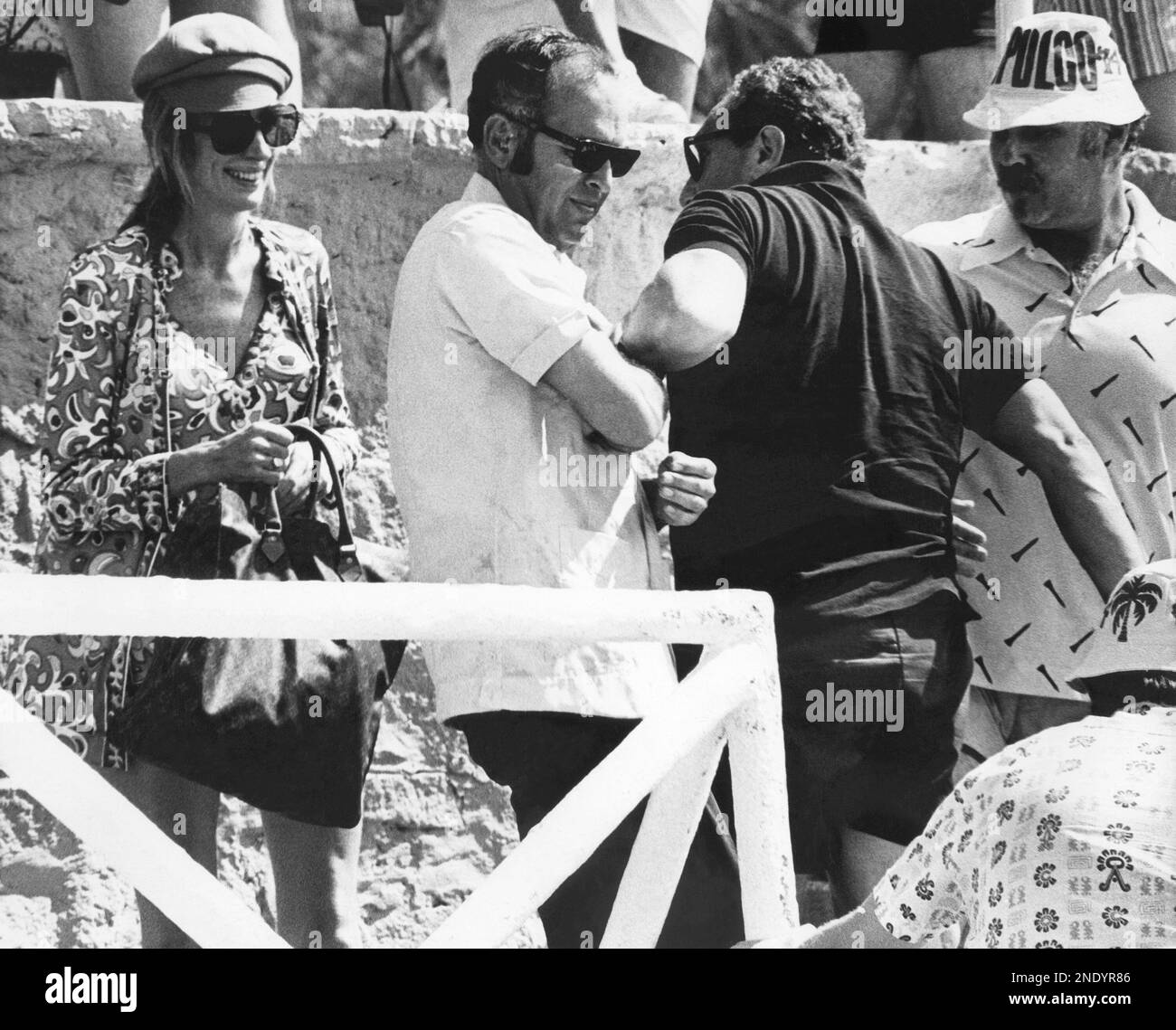 A Secret Service agent steadies Secretary of State Henry Kissinger on ...