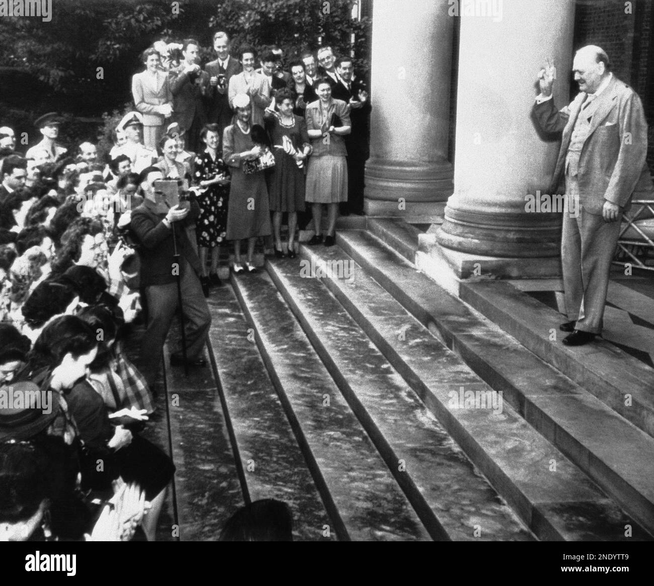 With his hand in the famous V for Victory salute, British Prime ...
