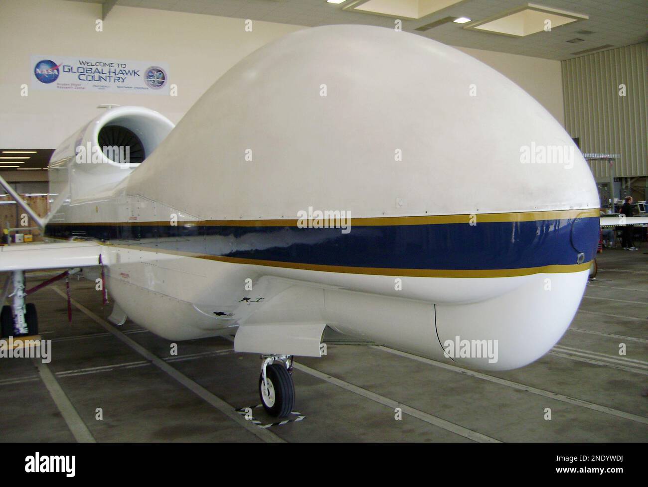A NASA Global Hawk robotic jet sits in a hangar at Dryden Flight ...