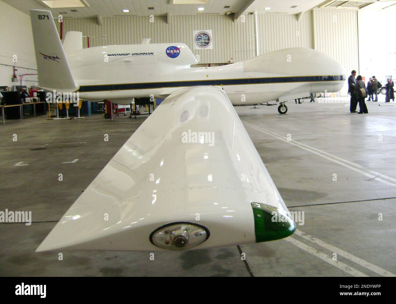A NASA Global Hawk robotic jet sits in a hangar at Dryden Flight ...