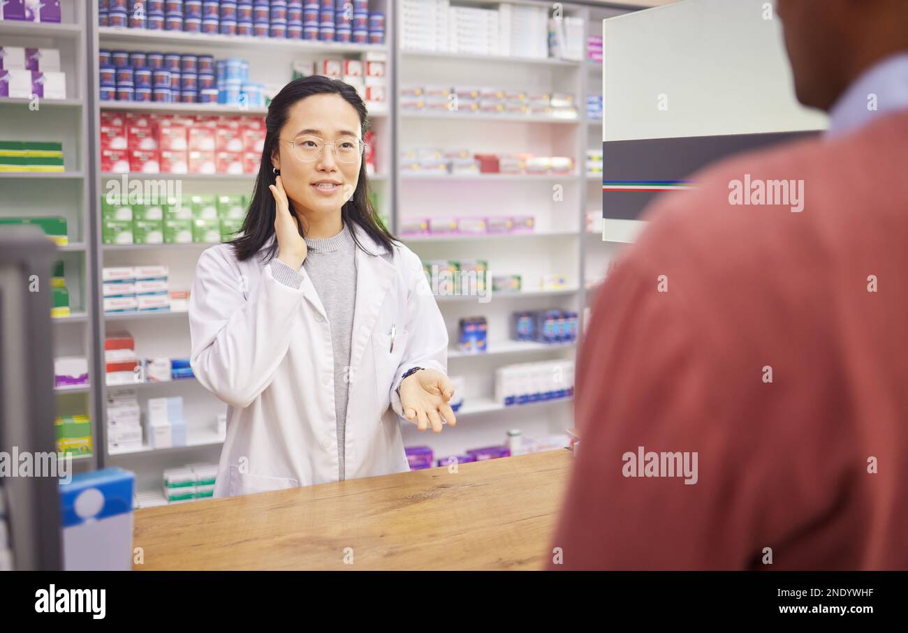 Pharmacy, help desk and pharmacist woman with customer service for neck ...
