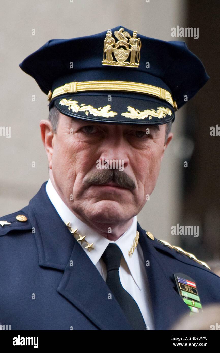 Tom Selleck films a scene on location for the television pilot "Reagan ...