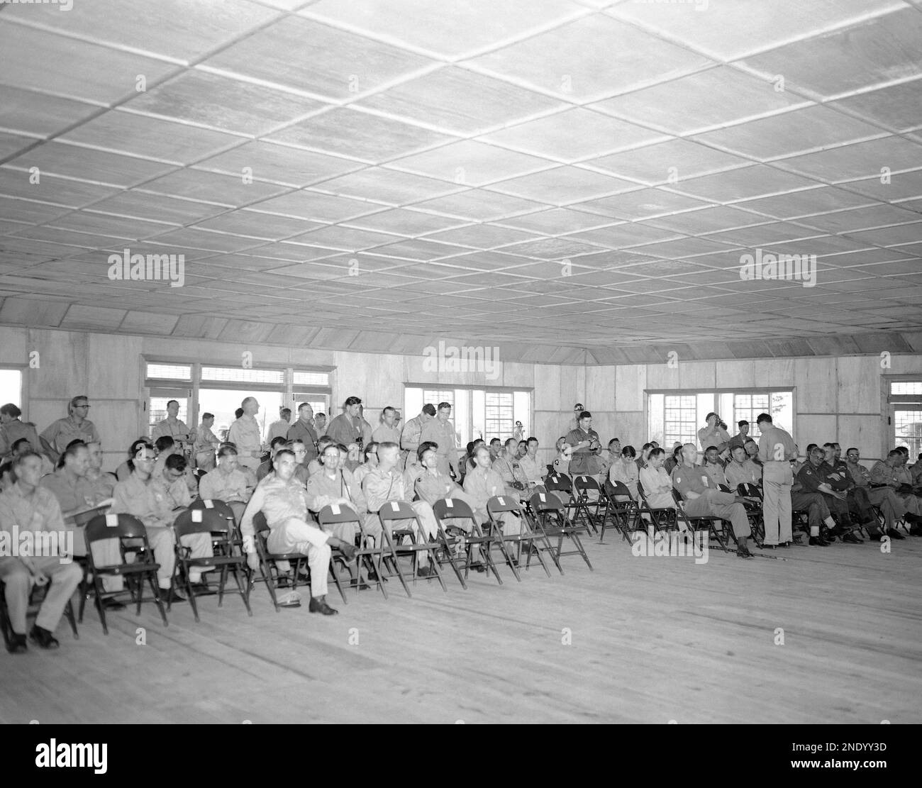 Witnesses on the Communist side of Armistice Hall primly sit in place ...