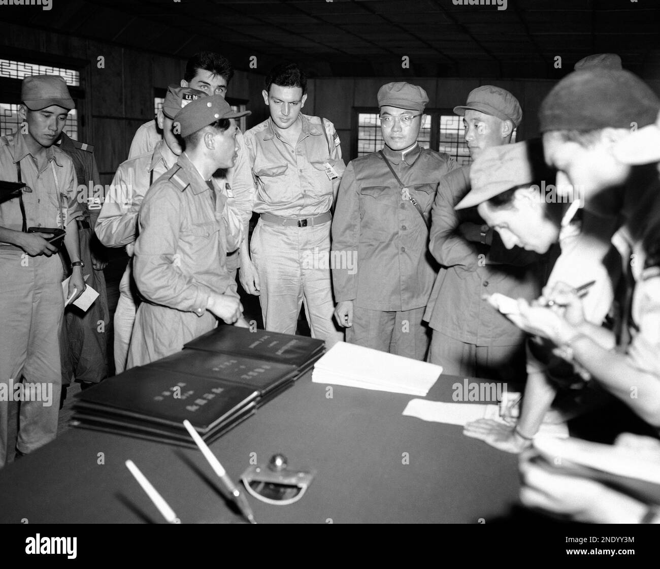A communist security guard talks to United Nations and Communist ...