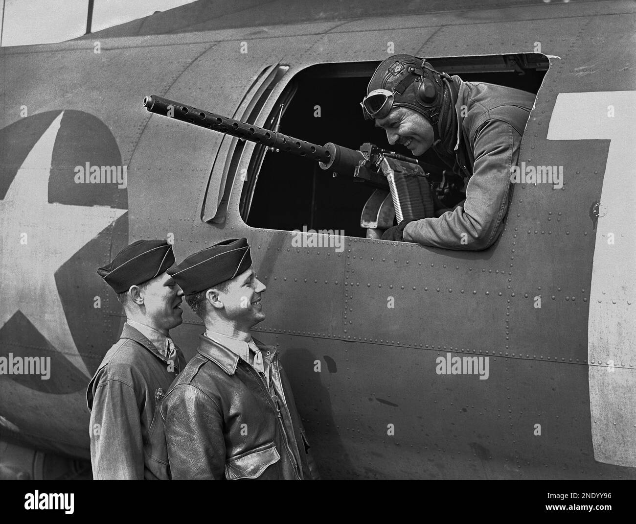 American film star Clark Gable at the waist gun position of his Flying ...