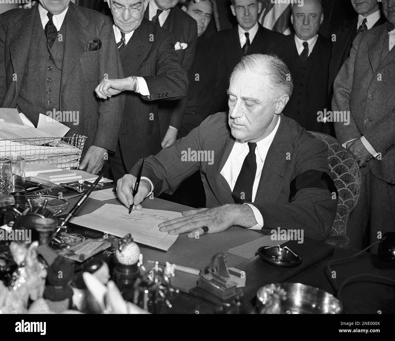 With jaw jutting, President Roosevelt get signature to a declaration of ...