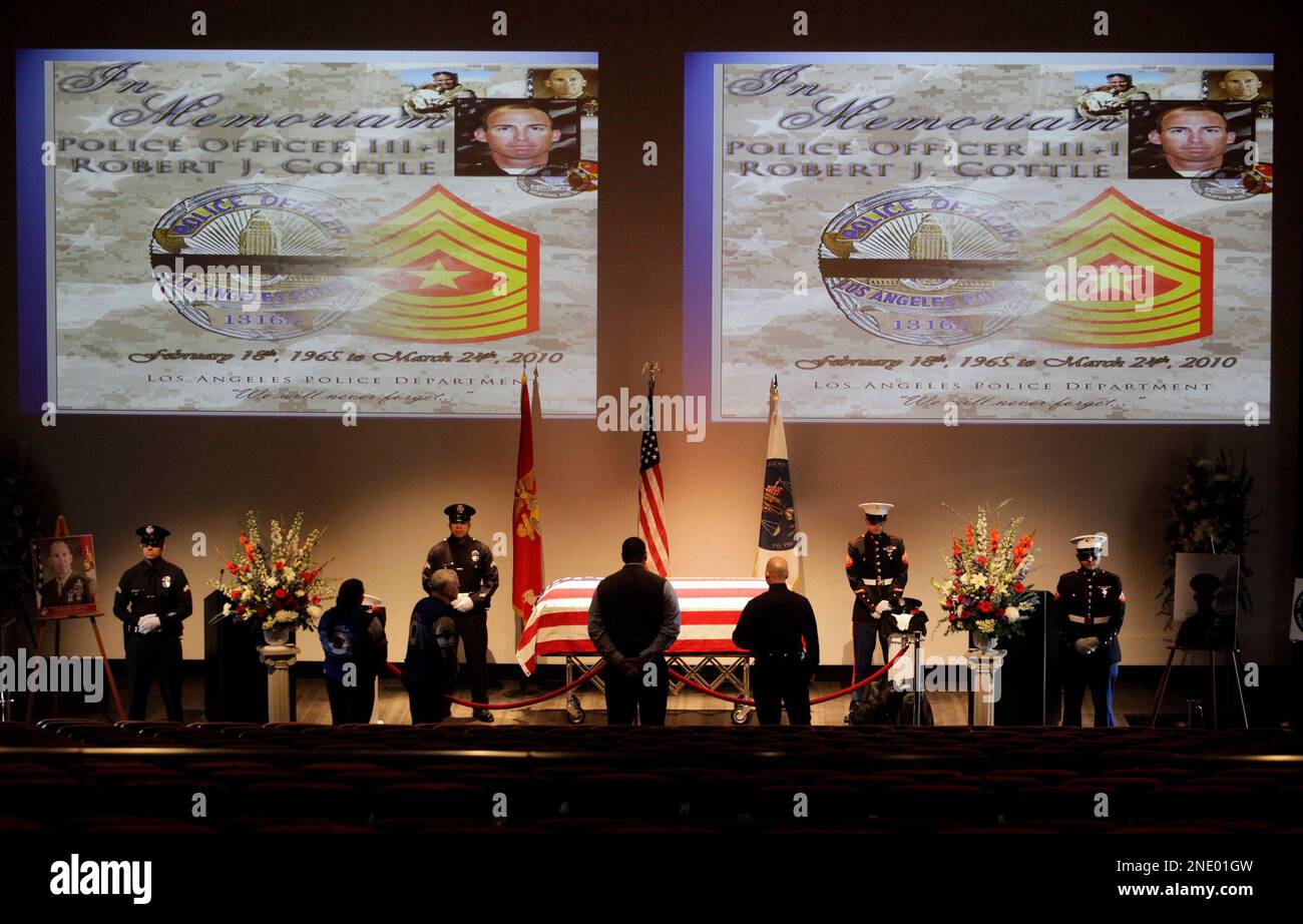 Los Angeles Police officers and U.S. Marines stand on guard during a ...