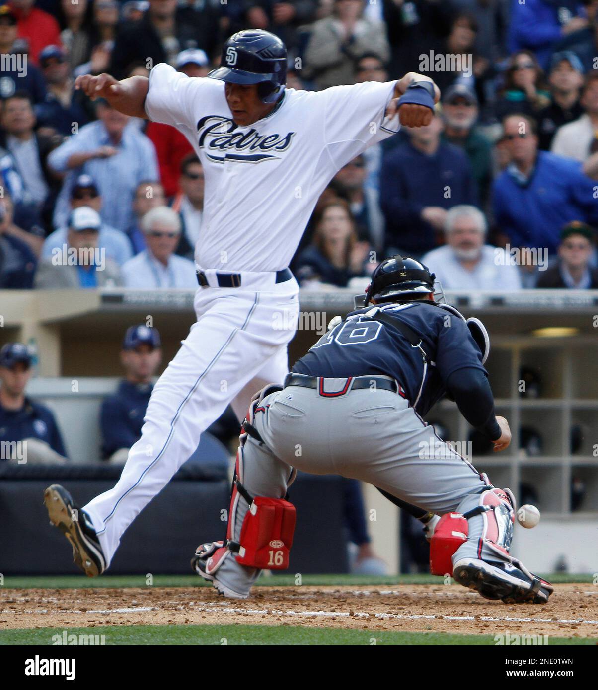 San Diego Padres' Kyle Blanks beats the throw to Atlanta Braves catcher ...