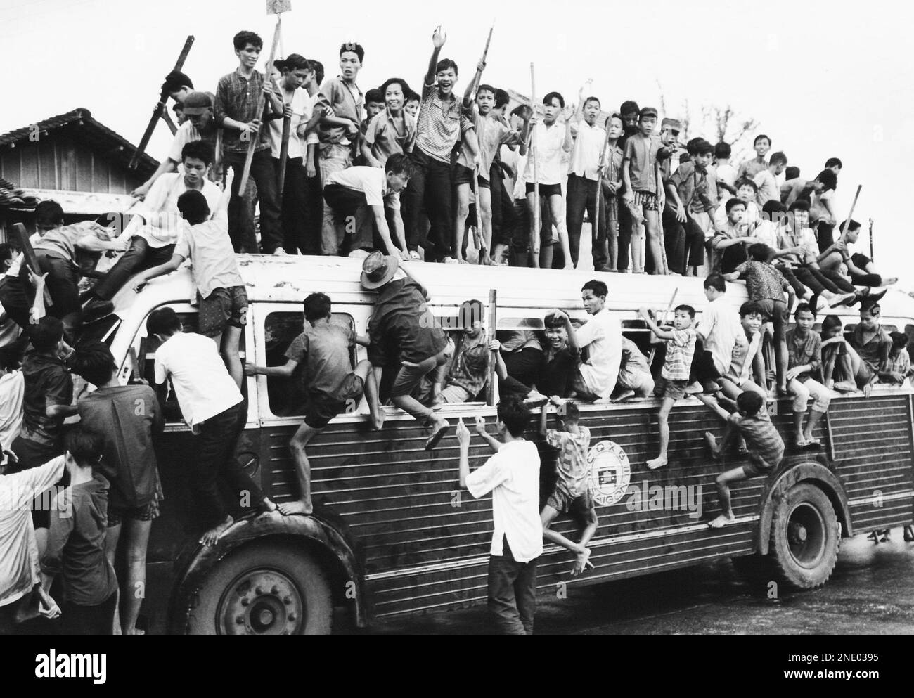 Predominantly Buddhist students, armed with crude weapons, atop a city ...
