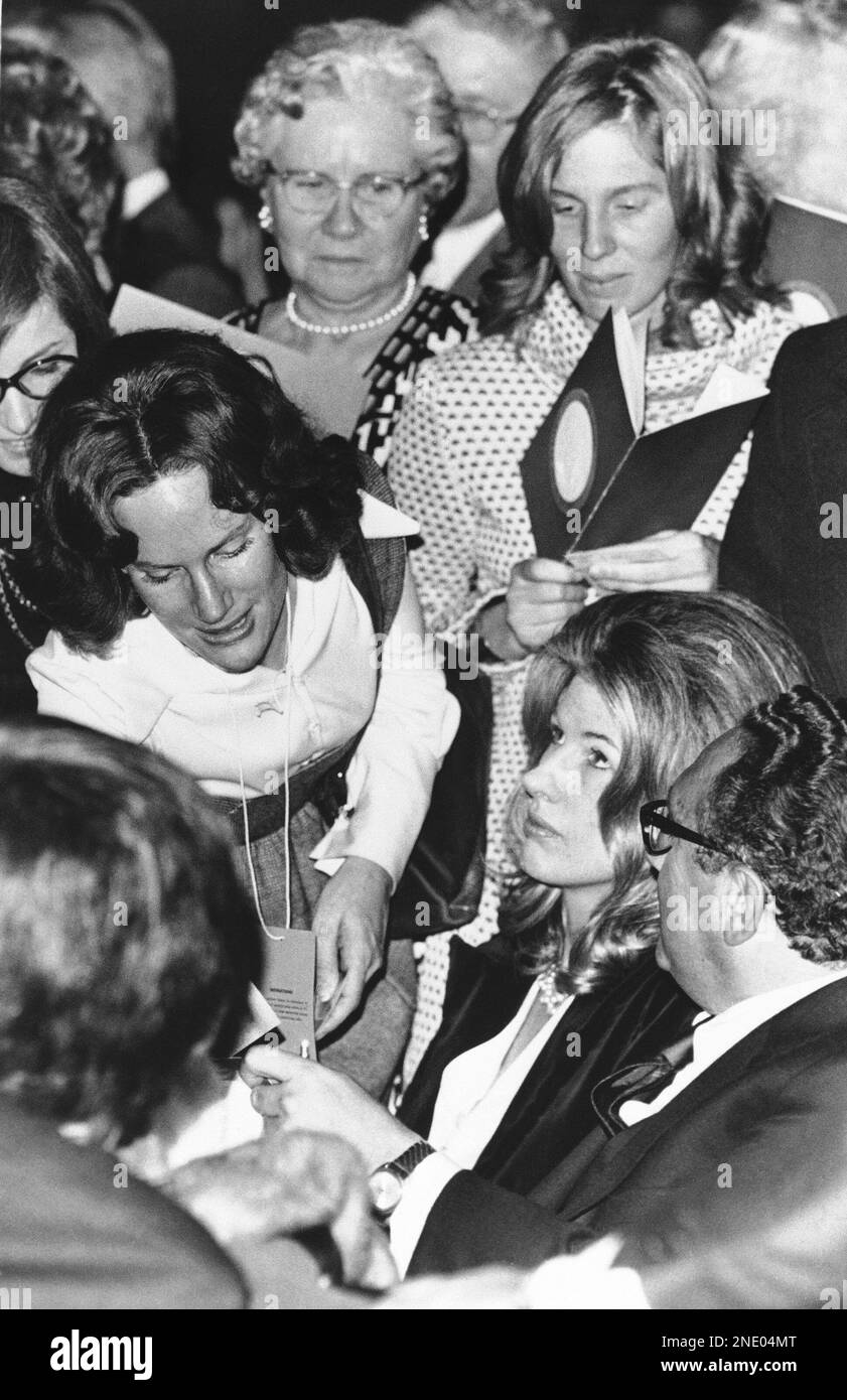 Presidential advisor Henry Kissinger, lower right, signs autographs ...