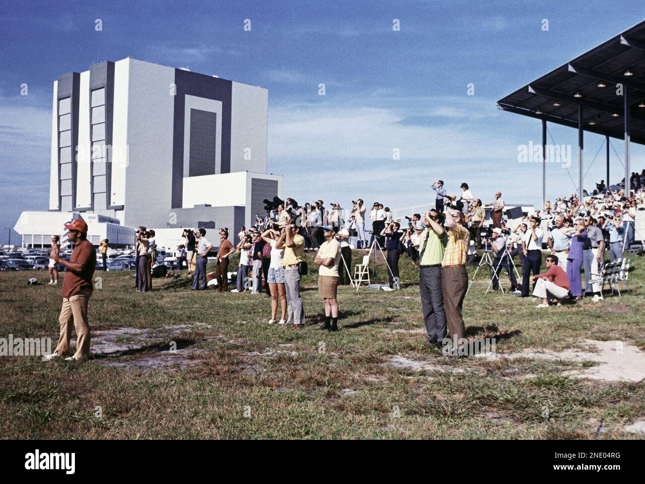 All eyes and cameras at the Kennedy Space Center press site follow the ...