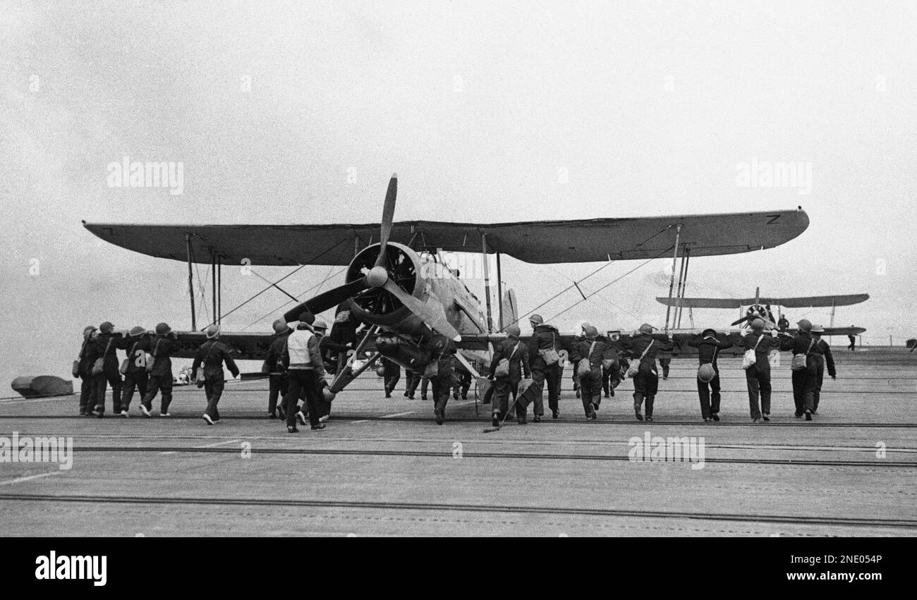 Britain's Royal Navy Aircraft Carrier H.M.S. Battler, a merchant ship ...