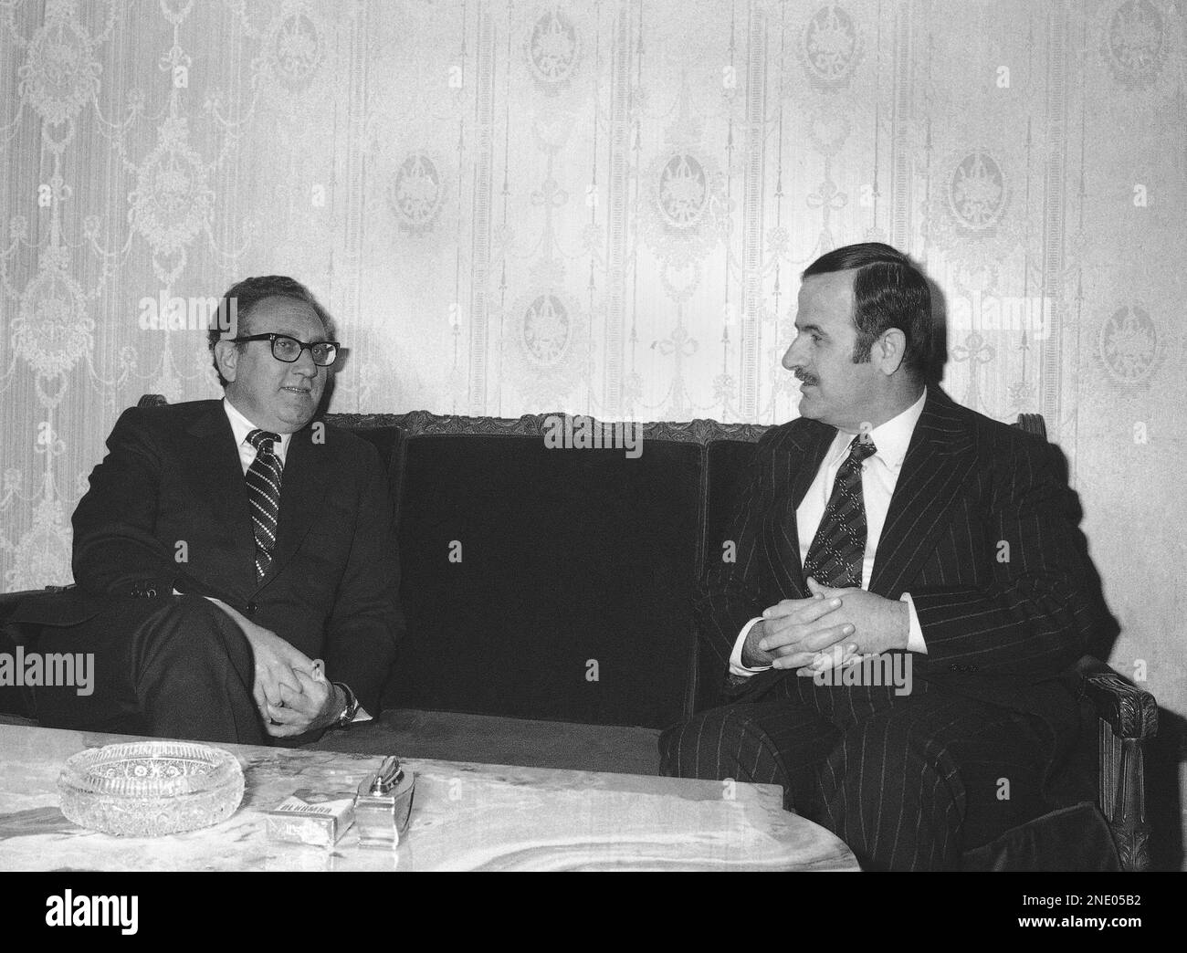 U.S. Secretary of State Henry Kissinger, left, and Syrian President ...