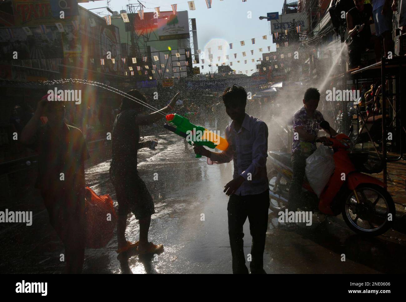 Thais and tourists spray water to each others during the Songkran ...