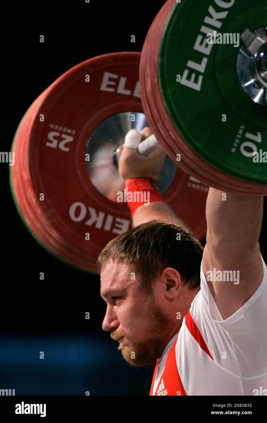 Russia's Evgeny Chigishev successfully lifts a weight in the Men's ...
