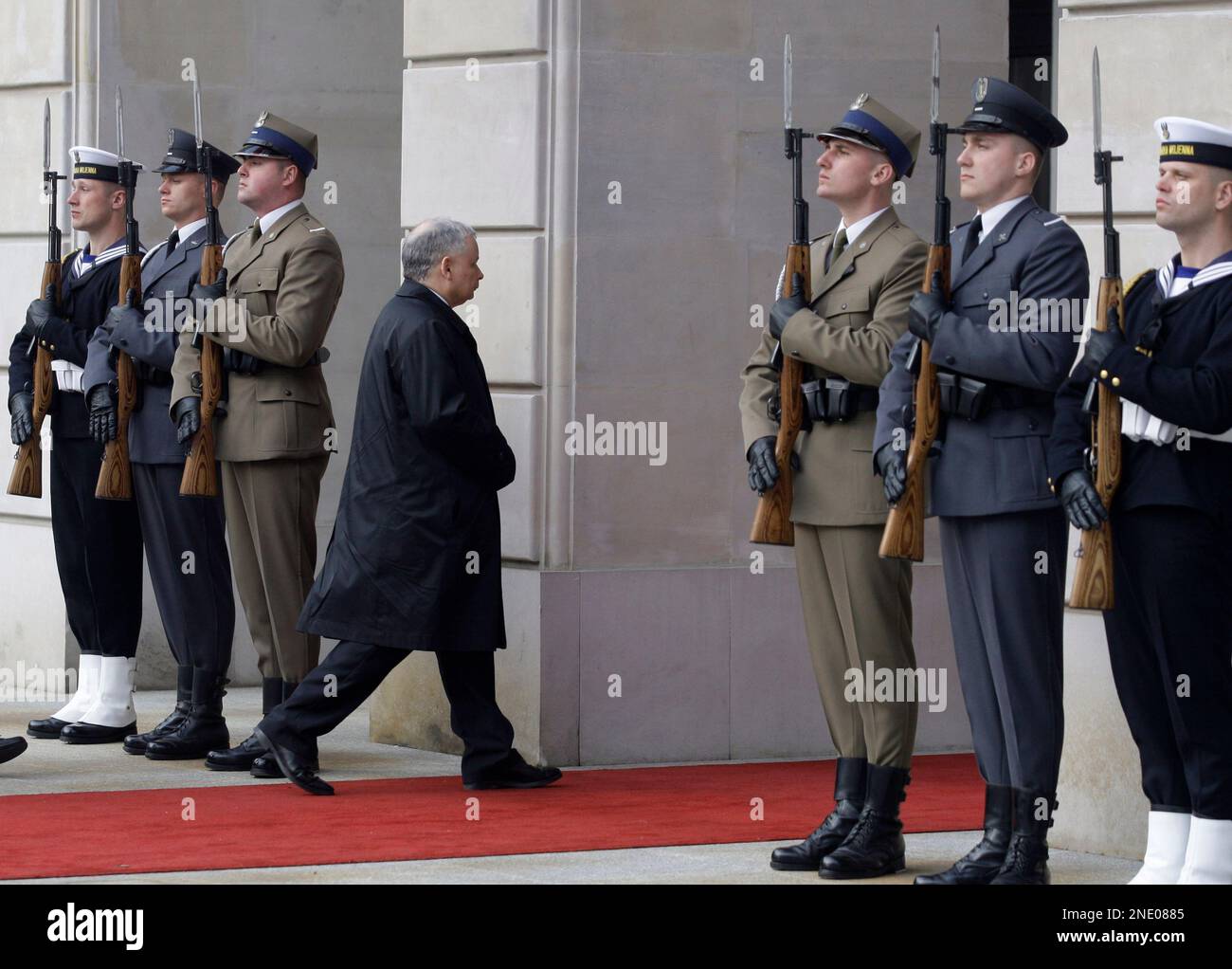 Jaroslaw Kaczynski walks past the guard of honor after the coffin ...