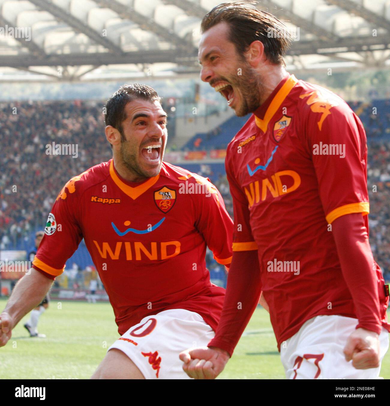 AS Roma defender Marco Cassetti, right, reacts after scoring joined by ...