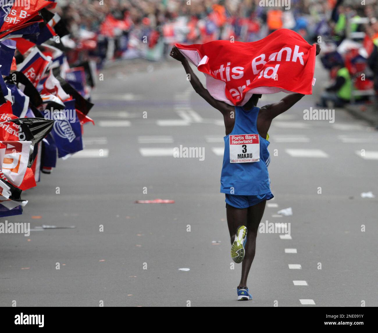 Patrick Makau of Kenya reacts, after crossing the finish line to win ...