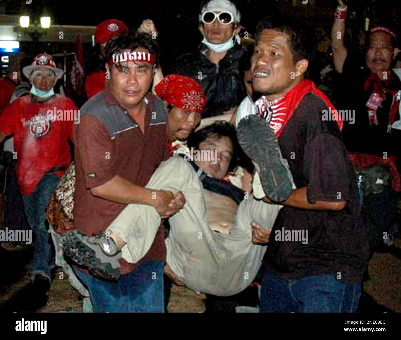 Protesters help carry Hiro Muramoto, a 43-year old Tokyo-based Japanese ...
