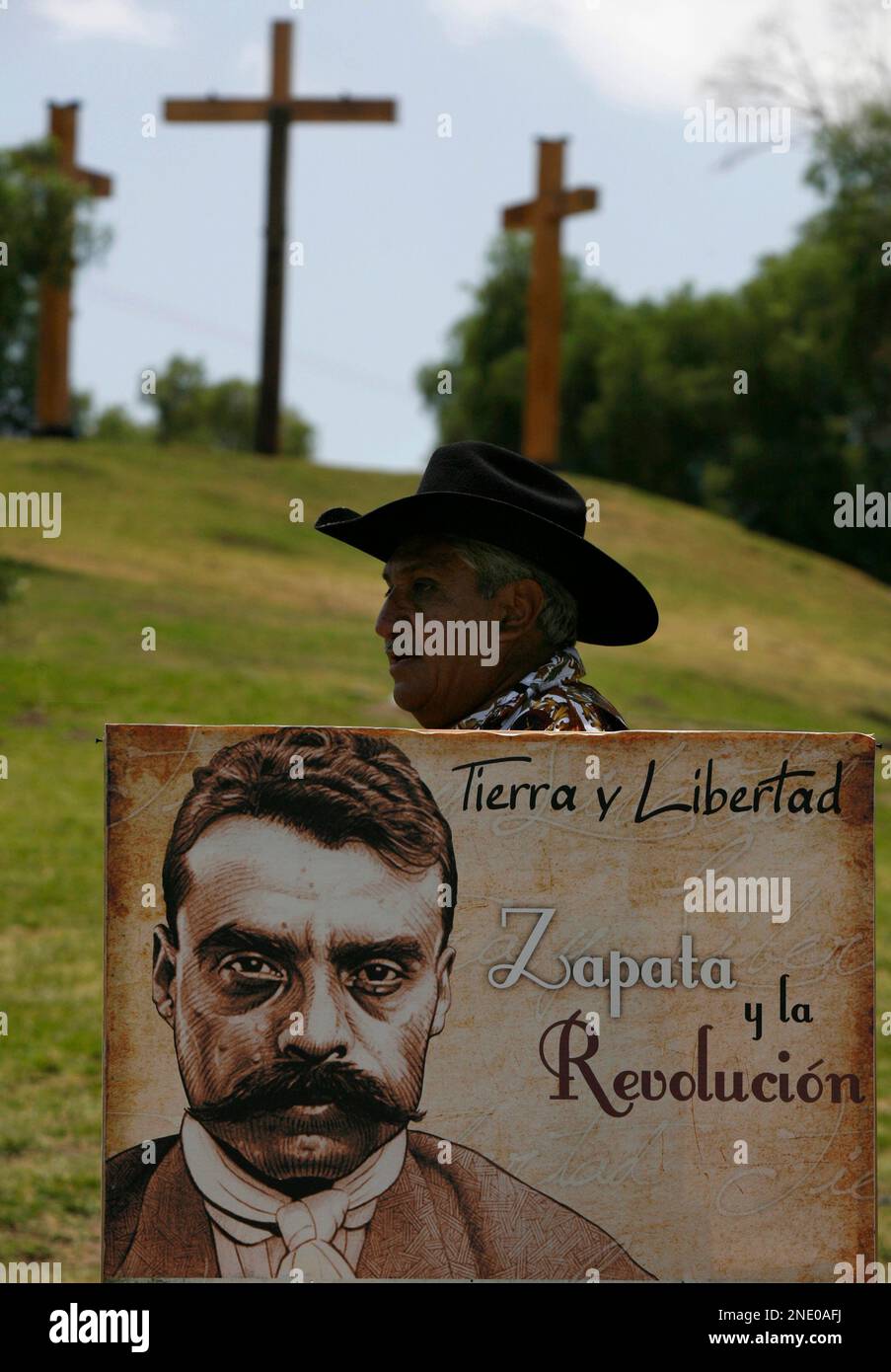 A man carries an image of the late Mexican revolutionary leader ...