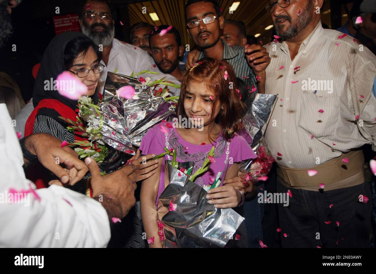 People greet Maryam Saddiqui upon her arrival at Quaid-e-Azam airport ...