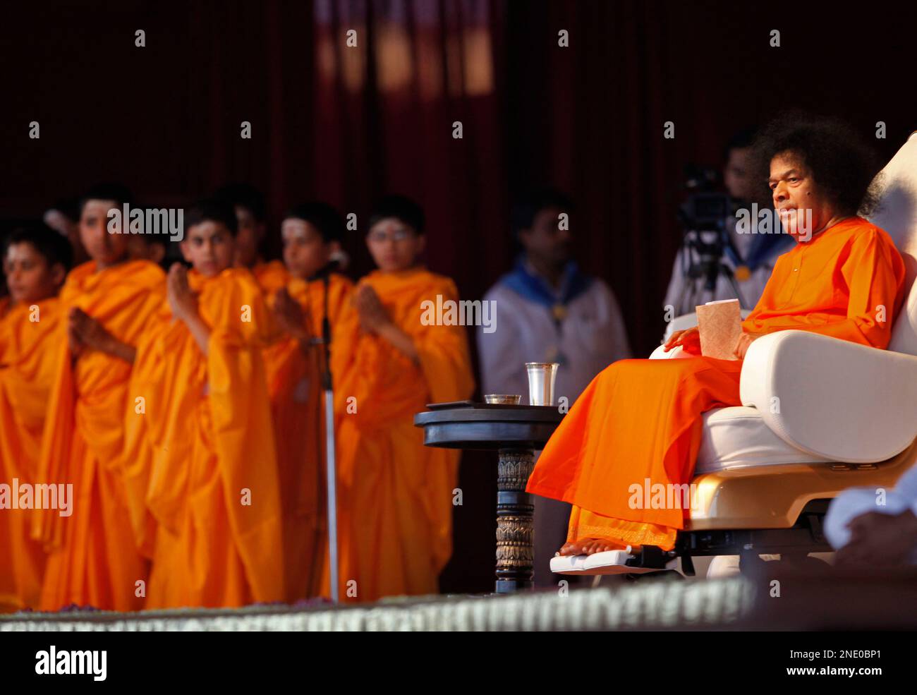 Indian spiritual leader Sathya Sai Baba, right, looks on at a function ...