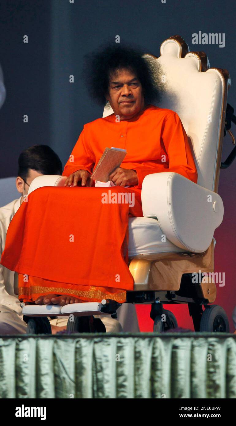 Indian spiritual leader Sathya Sai Baba looks on at a function to meet ...